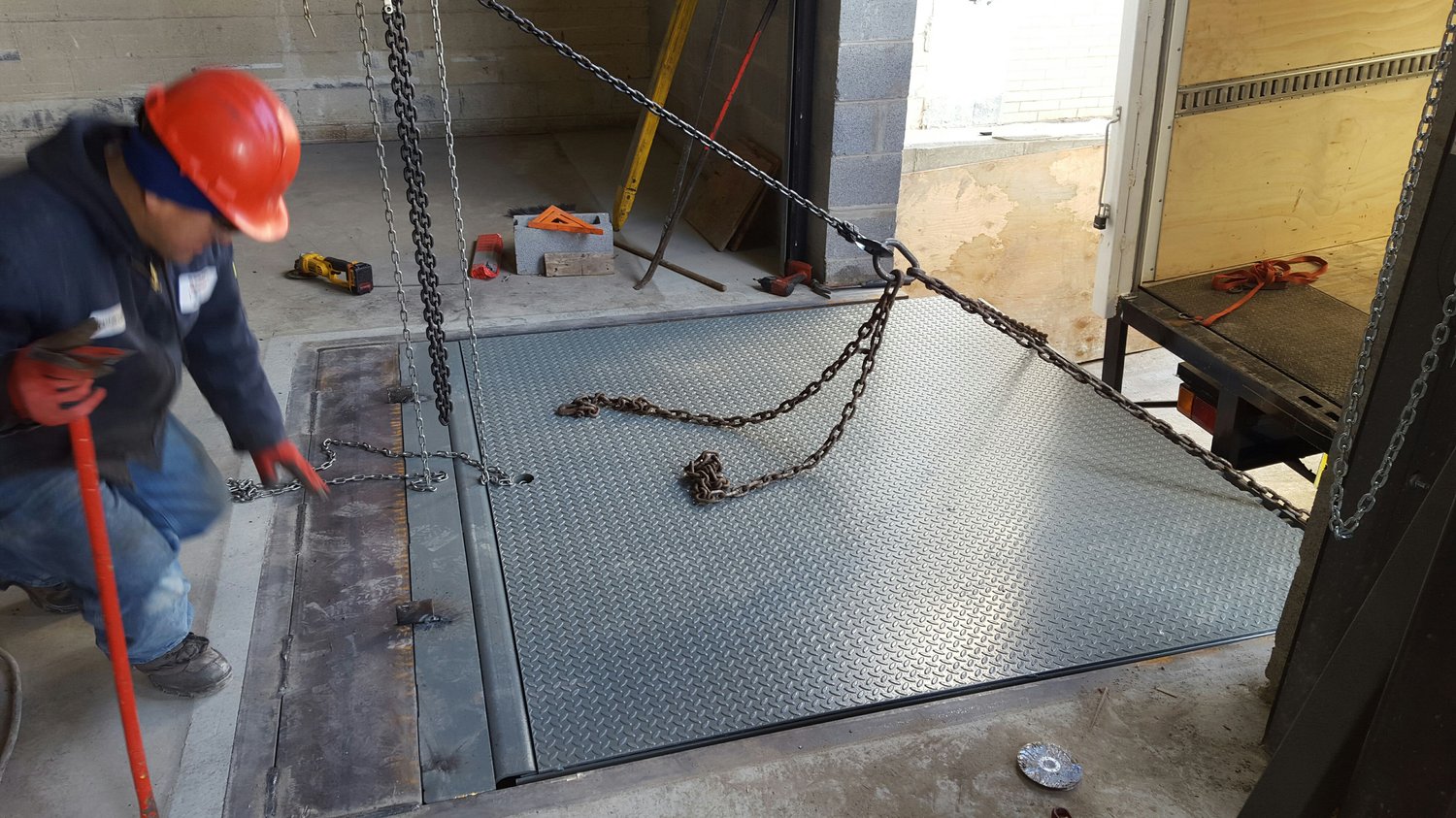 Extended Dock Levelers & Tapered Seals for Declining Driveways