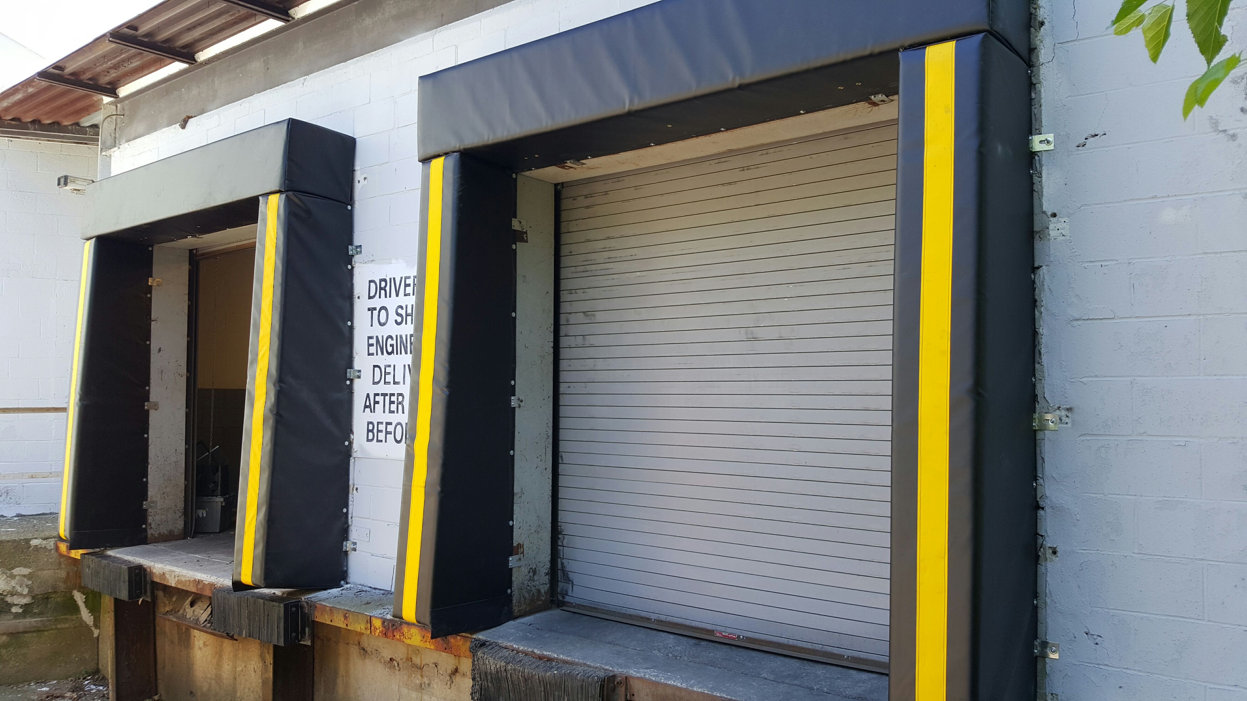 Extended Dock Levelers & Tapered Dock Seals for Declining Driveways